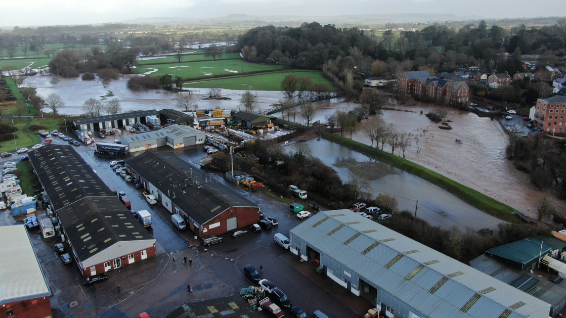 Flood rescues and school closures as storm hits