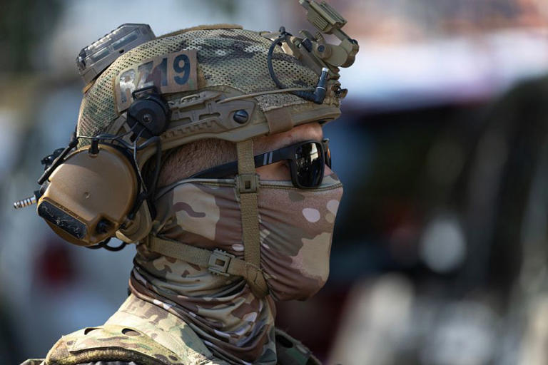 Why do ICE officers wear masks – and is it legal?