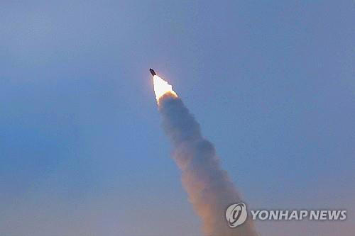 N Korea test-fires large-caliber multiple rocket launcher with Kim in ...