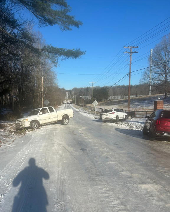 10-13 cars slide off ice-covered High Point Road in Winston-Salem