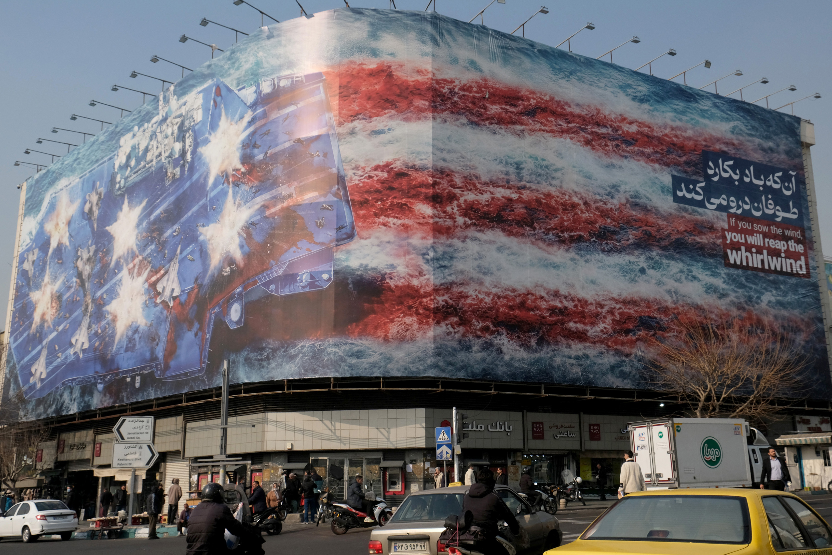 Iran billboard depicts US aircraft carrier streaked in blood