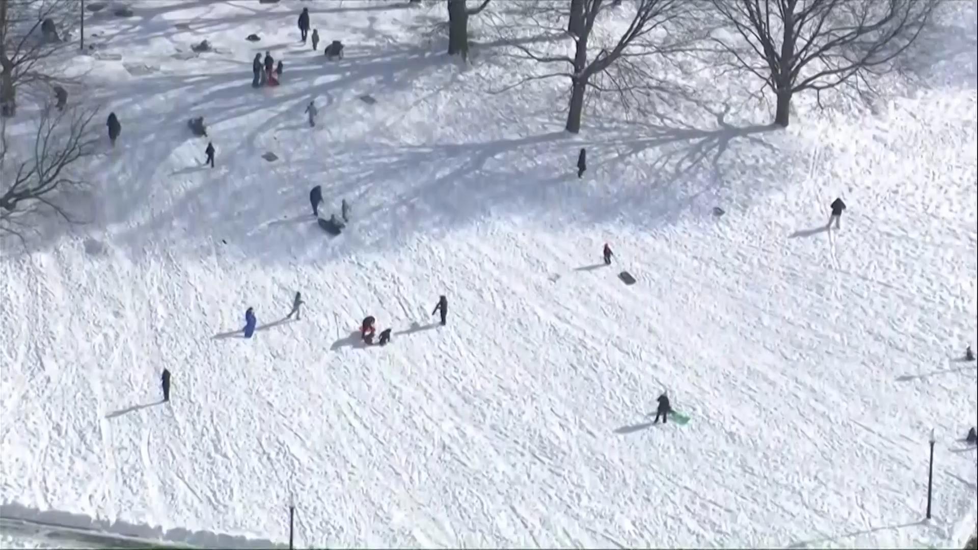 Parkgoers enjoy the snow in Boston as brutal cold lingers following ...