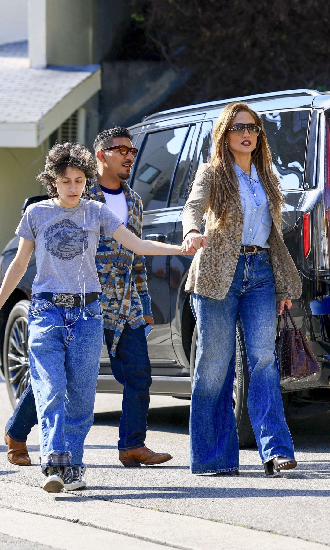 Jennifer Lopez and Emme Muñiz share a playful, hand-in-hand moment ...