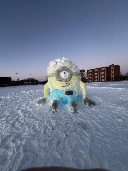 Students brave the cold to create giant snow minion at Vincennes University