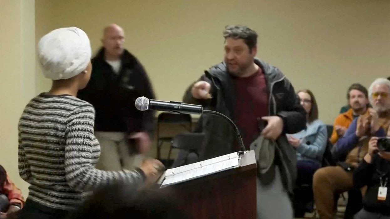 Man charges Ilhan Omar at podium and sprays her with mystery substance ...