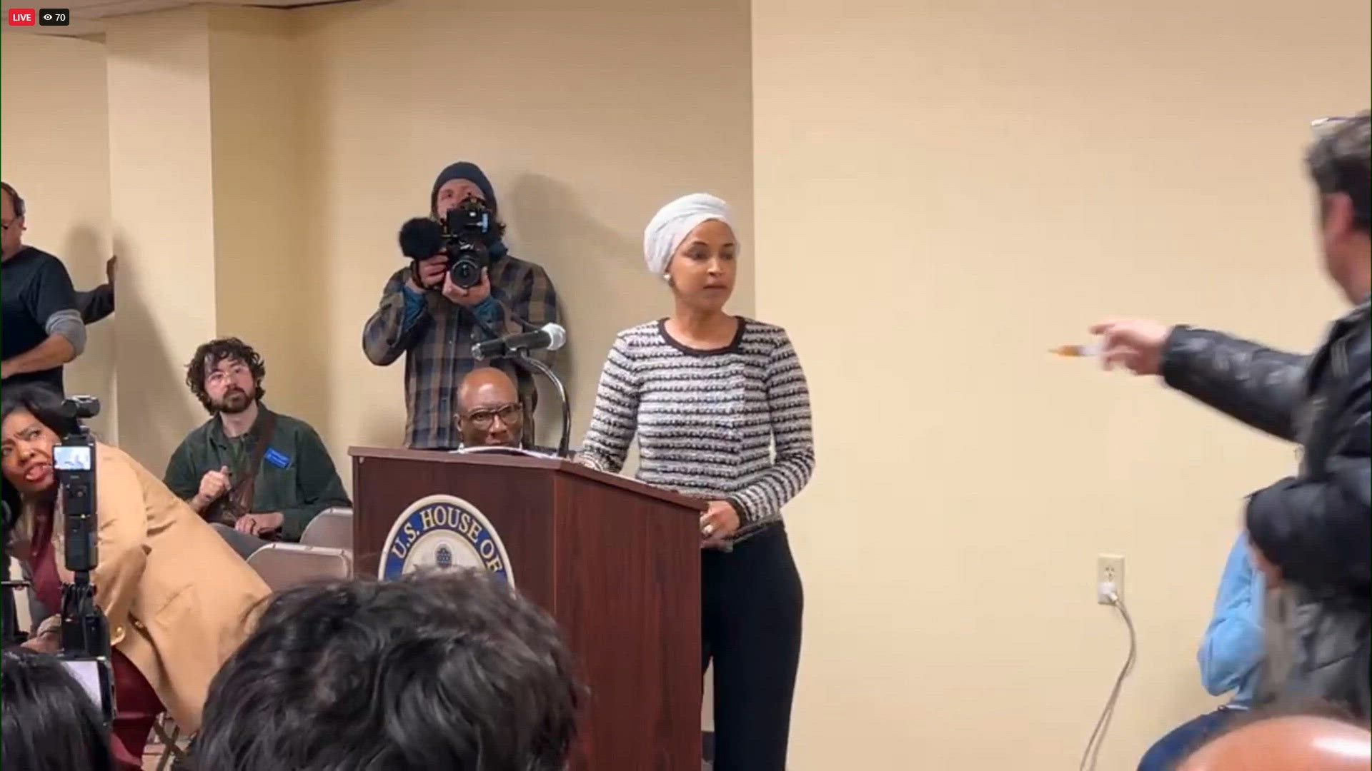 Rep. Ilhan Omar of Minnesota is charged during town hall meeting