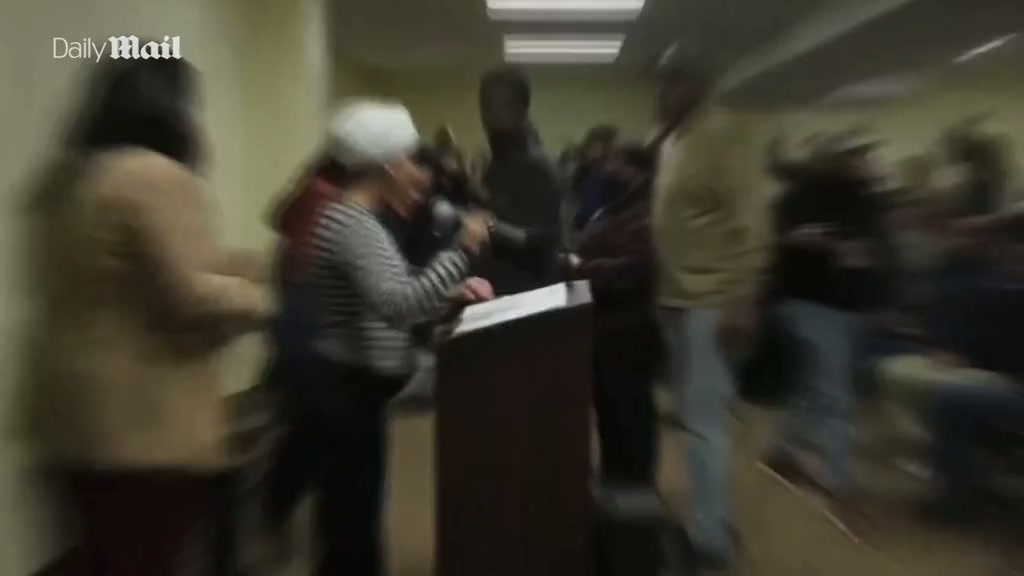 Man sprays Ilhan Omar during speech calling for Noem resignation