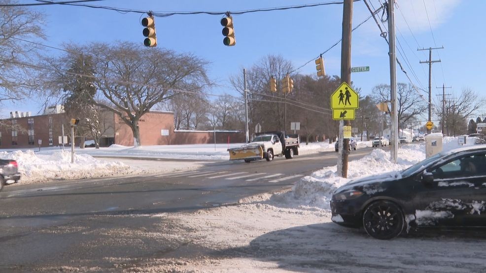 Rhode Island schools work to clear snow-covered sidewalks after winter ...