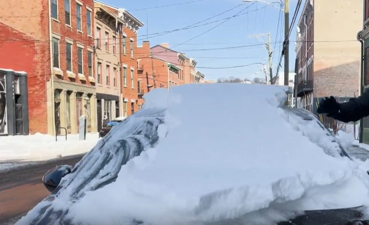 Downtown Cincinnati residents and drivers digging out of snow after storm