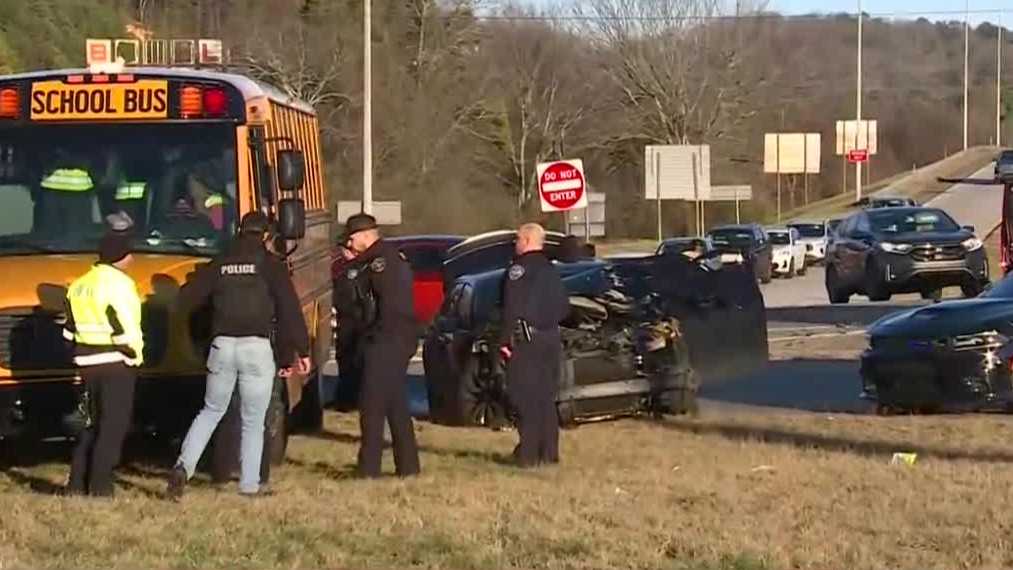 Large police presence on scene of major crash involving school bus in ...