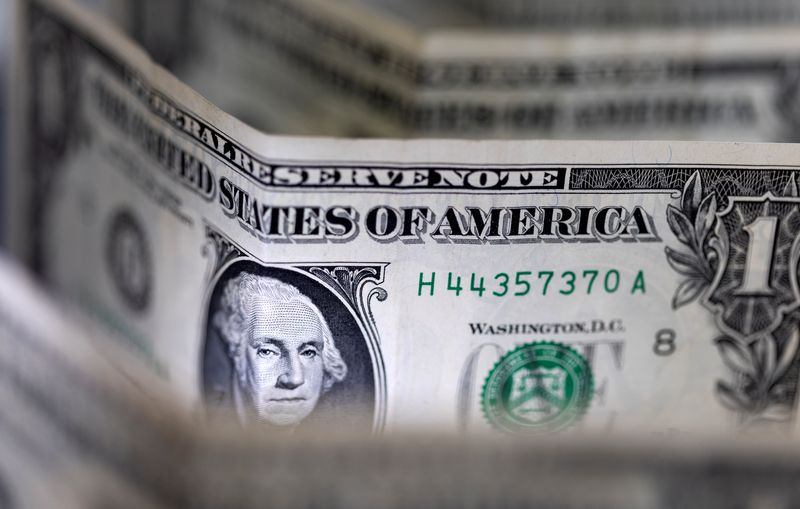 Dollar sinks to four-year low, Trump brushes off the decline