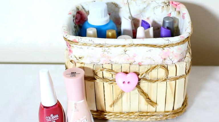 Turn an old plastic container into an artsy small bathroom storage solution