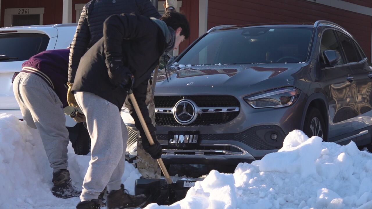 Group of roommates help dig neighbors out of snow at Redpoint Apartment ...