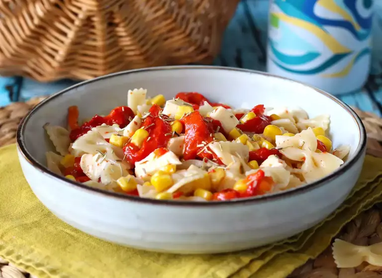 Cold pasta salad with peppers, corn and mozzarella
