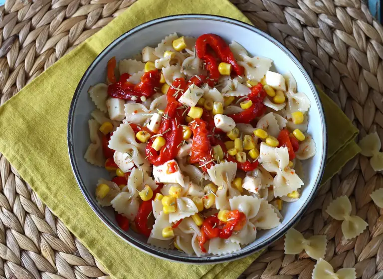 Cold pasta salad with peppers, corn and mozzarella