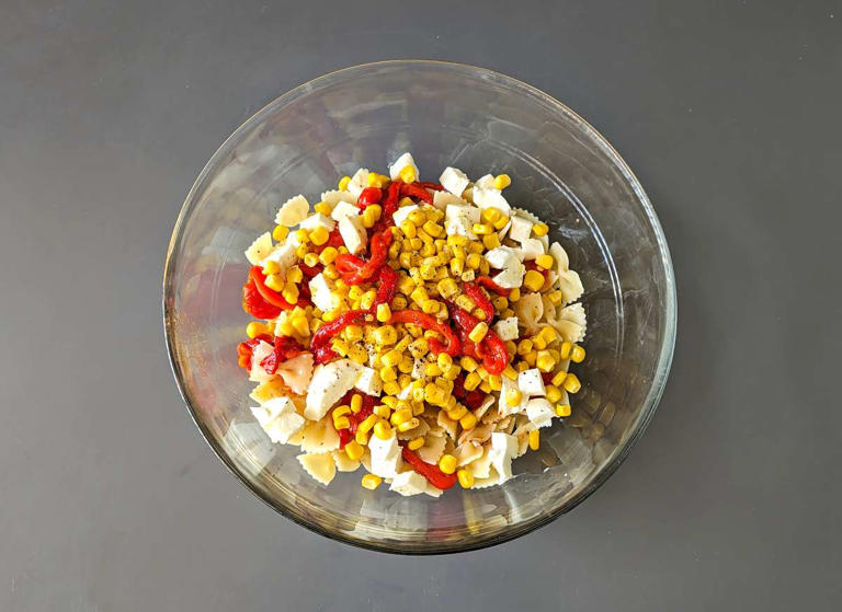 Cold pasta salad with peppers, corn and mozzarella