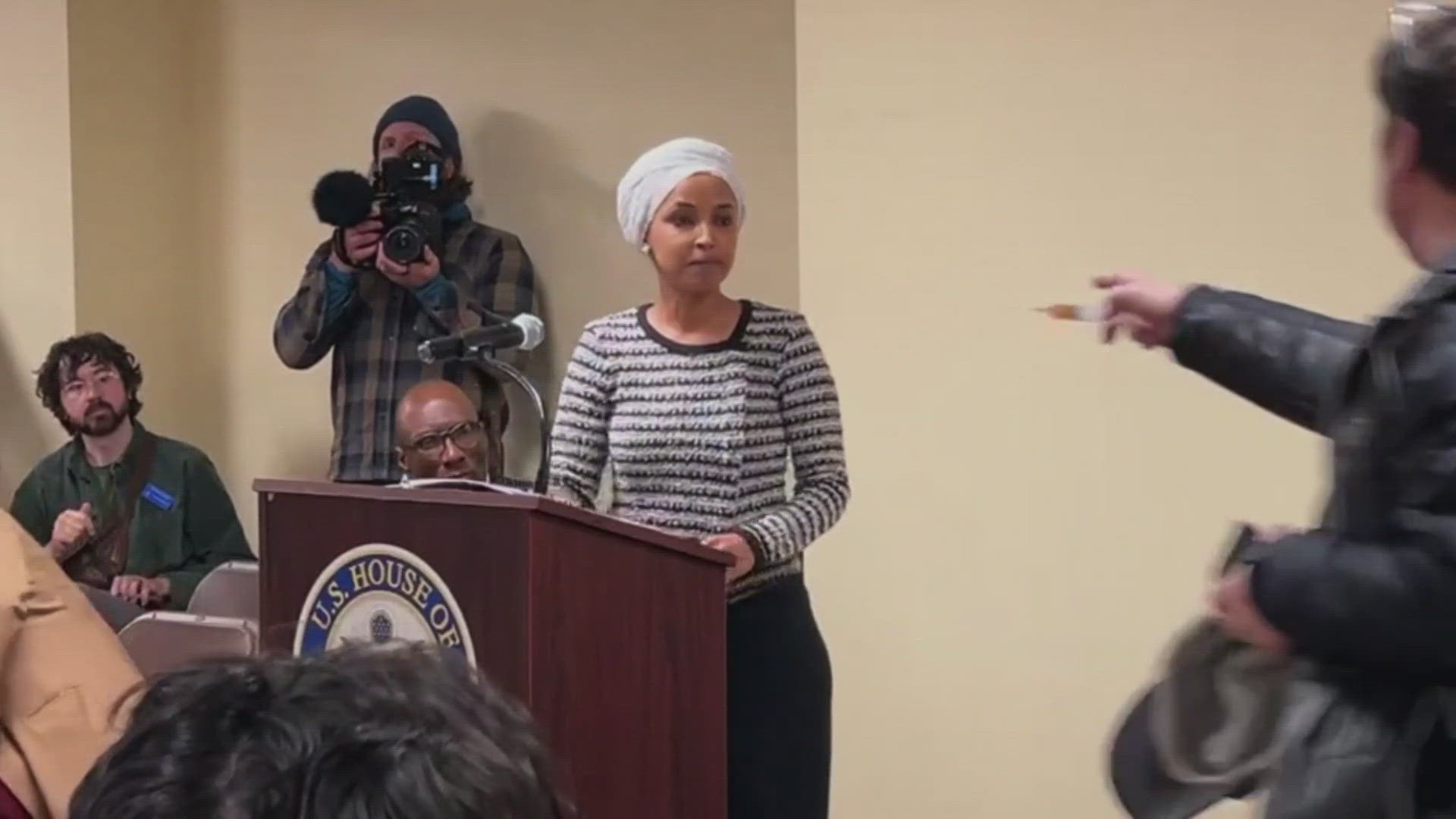 Man sprays liquid at US Rep. Ilhan Omar at town hall footage shows