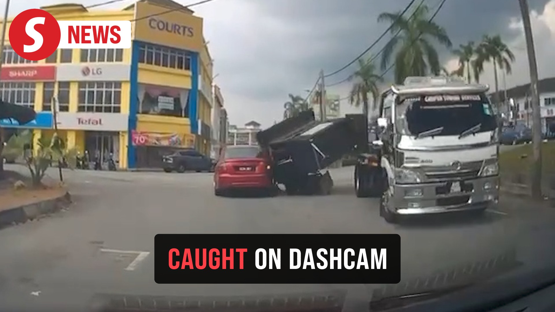 Burger stall topples onto motorcyclist