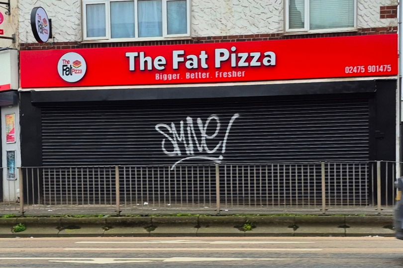 'Smile' tag graffitied on new pizza shop shutters before it even sells ...