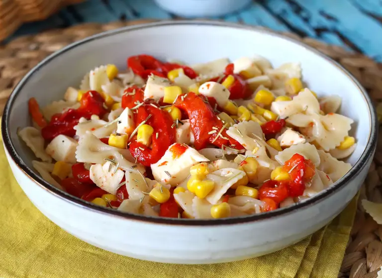 Cold pasta salad with peppers, corn and mozzarella