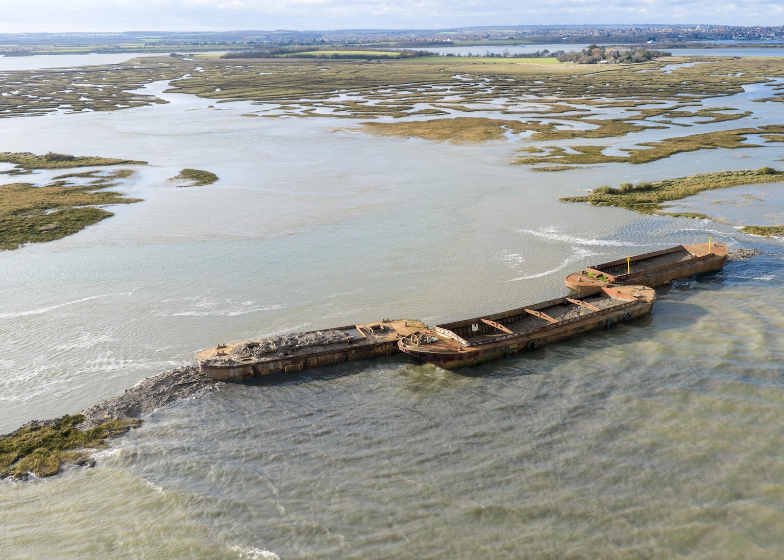 National Trust sinks three barges to form new island for birds