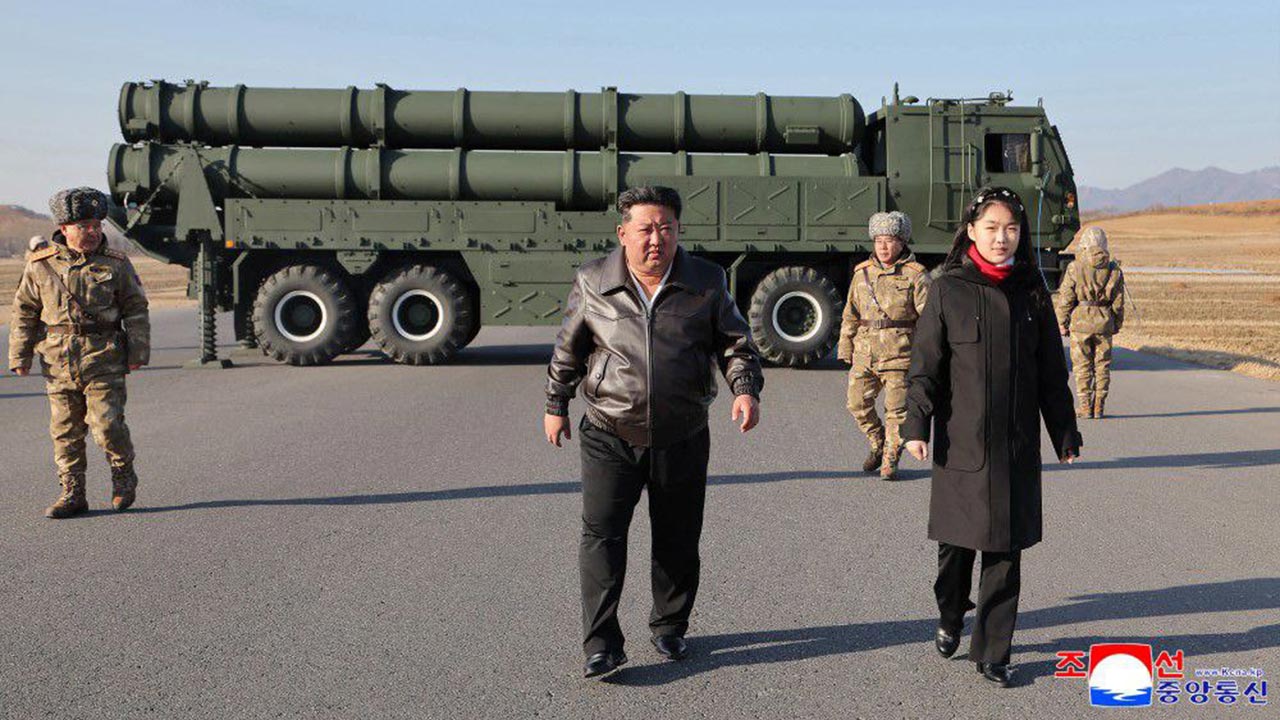 North Korea launches long-range rockets in test observed by Kim Jong Un ...