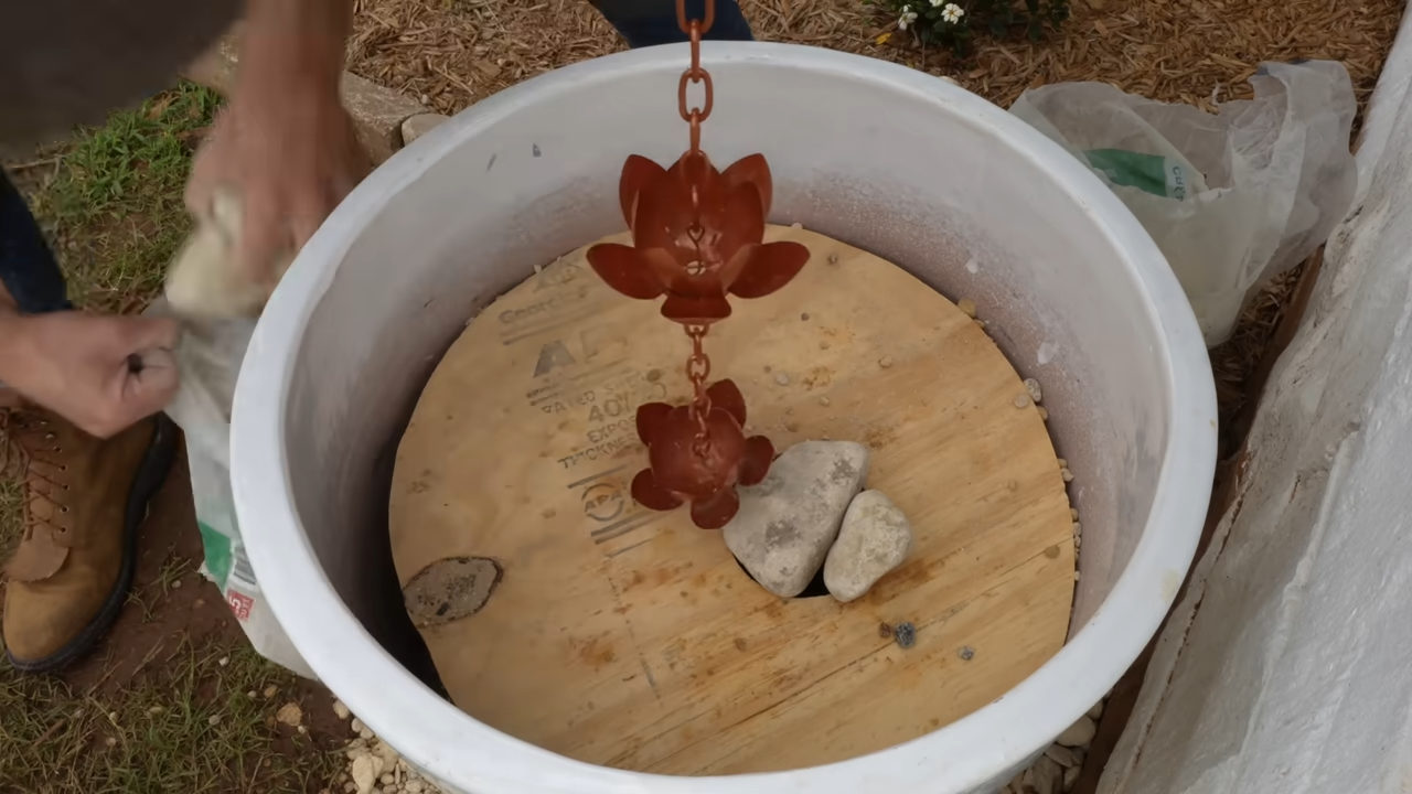 This looks way better than a downspout - Rain chain install with solar ...