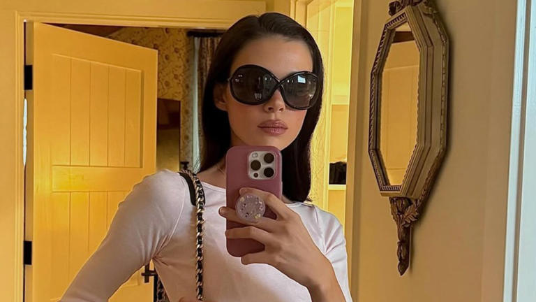 Nicola Peltz Beckham styles striped minidress right with Chanel bag