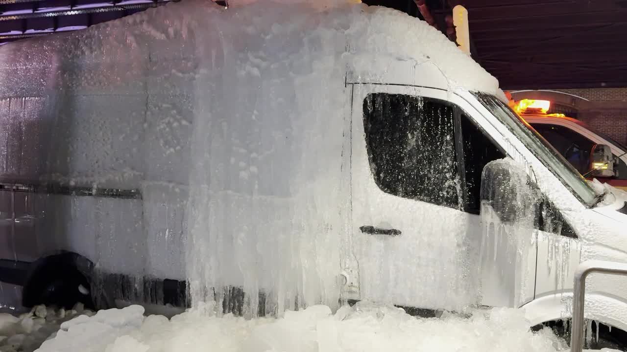 Truck encased in ice after parking beneath burst water pipe during ...