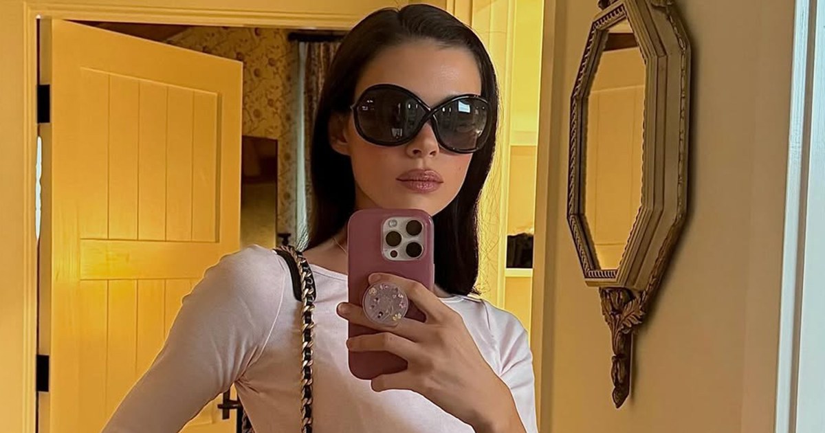 Nicola Peltz Beckham styles striped minidress right with Chanel bag