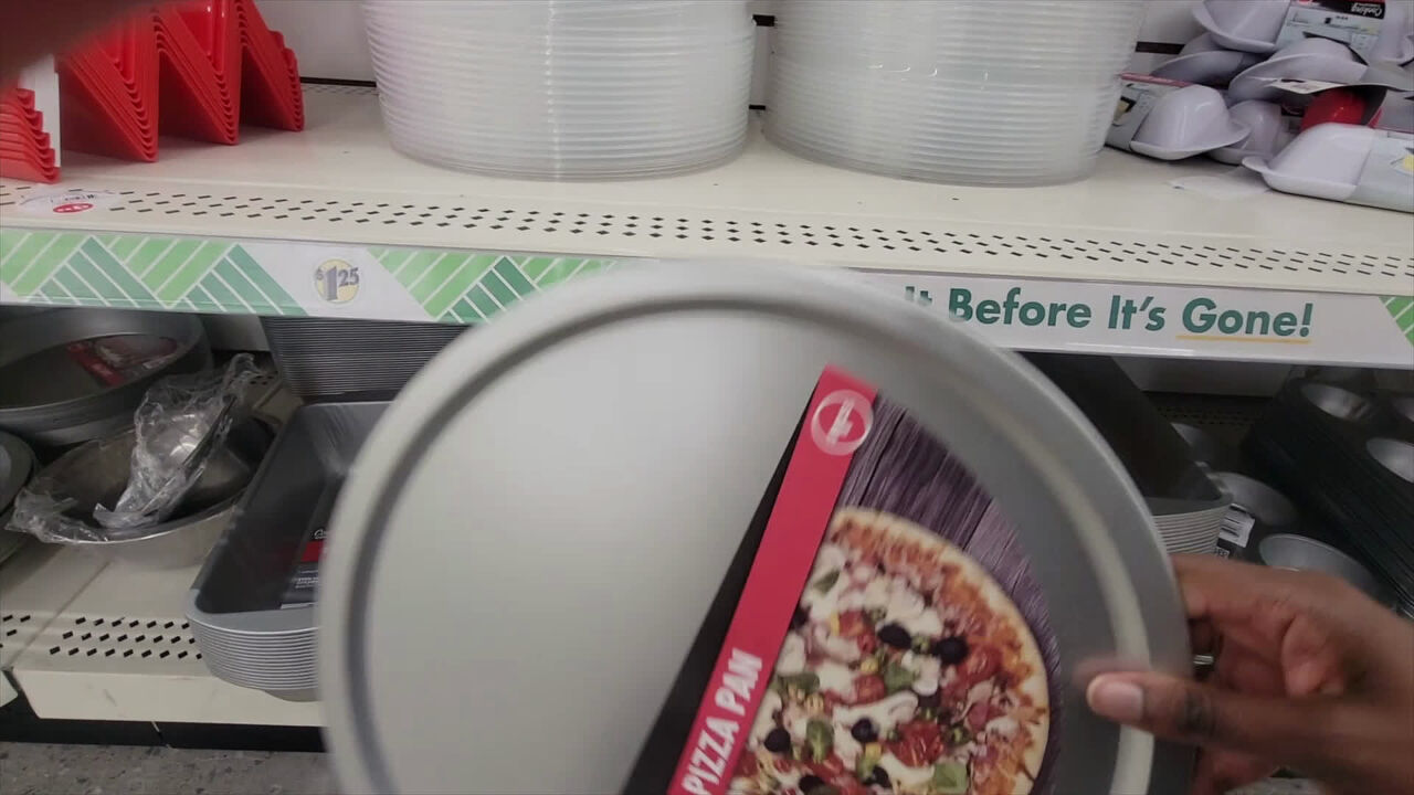 She grabs a Dollar Store pizza pan for this brilliant living room idea!