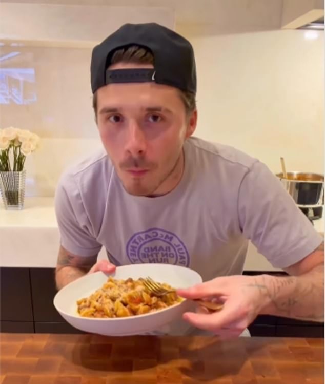 David Beckham shows estranged son Brooklyn how it's done by cooking in ...