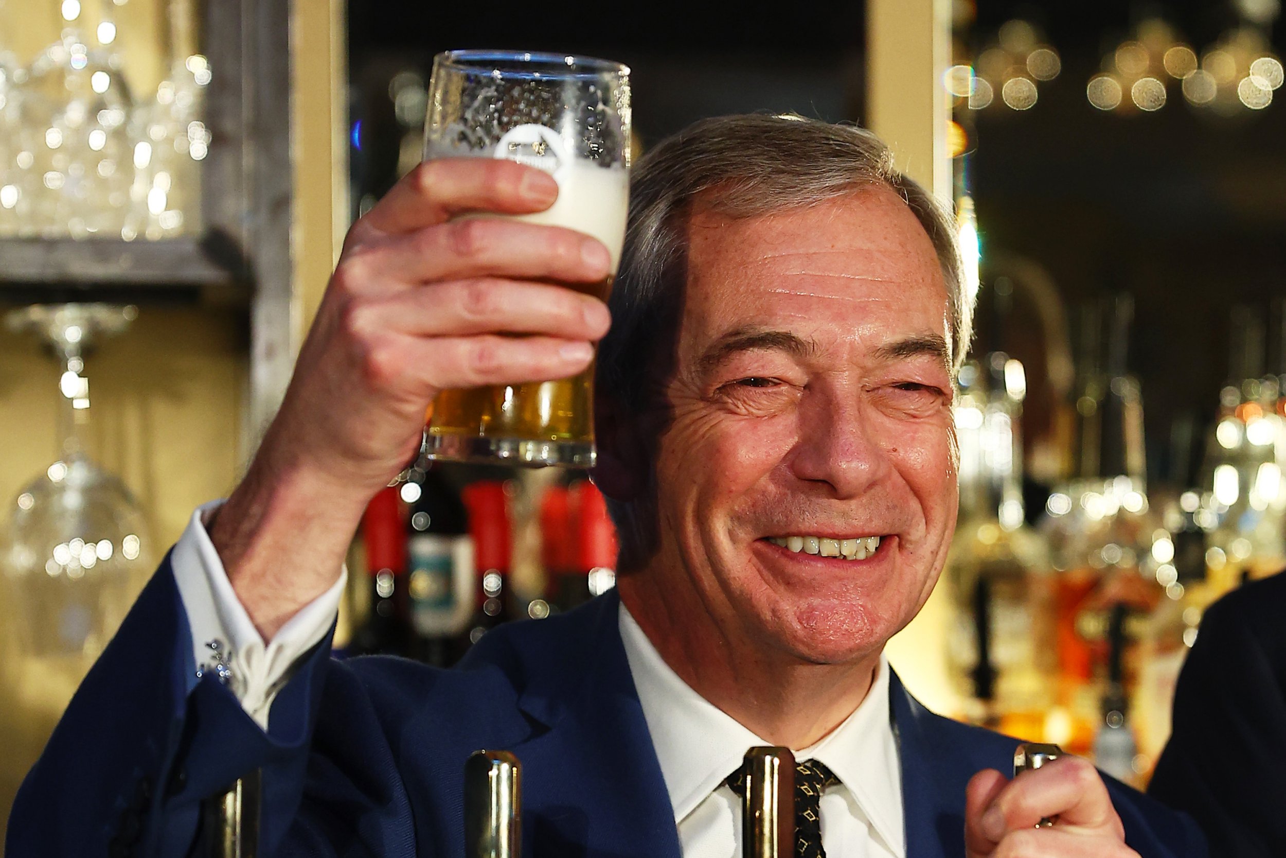 Farage unveils plan to cut price of pint by reinstating two-child ...