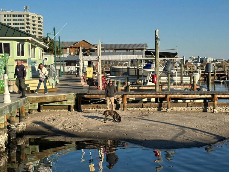 Low water reveals Crab Island; leaves boats on dry land around Destin