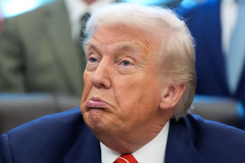 Trump scolds reporter for not smiling