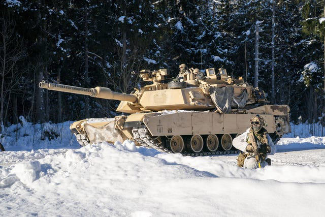 Soldiers wade through 'chest-deep' snow during training close to ...