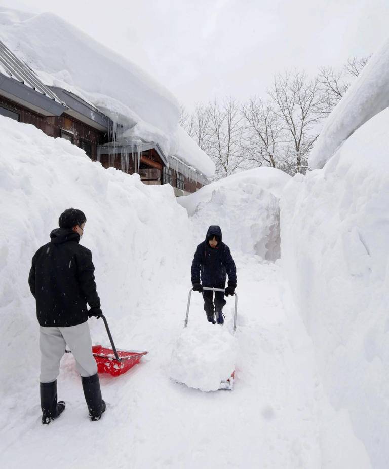 Heavy snow in northern Japan blocks roads and causes dozens of deaths