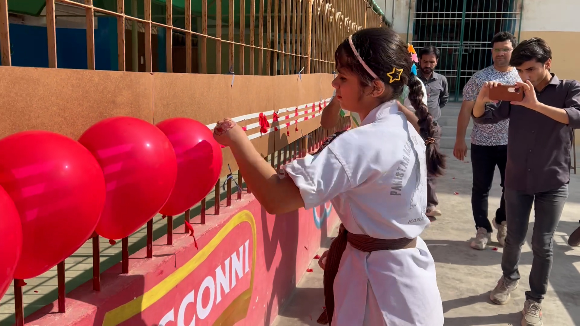 Most balloons burst while holding an egg in 30 seconds: 76 by Fatima Naseem