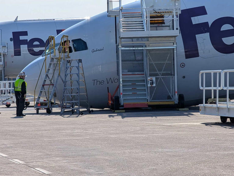 Nose gear collapses on parked FedEx cargo plane