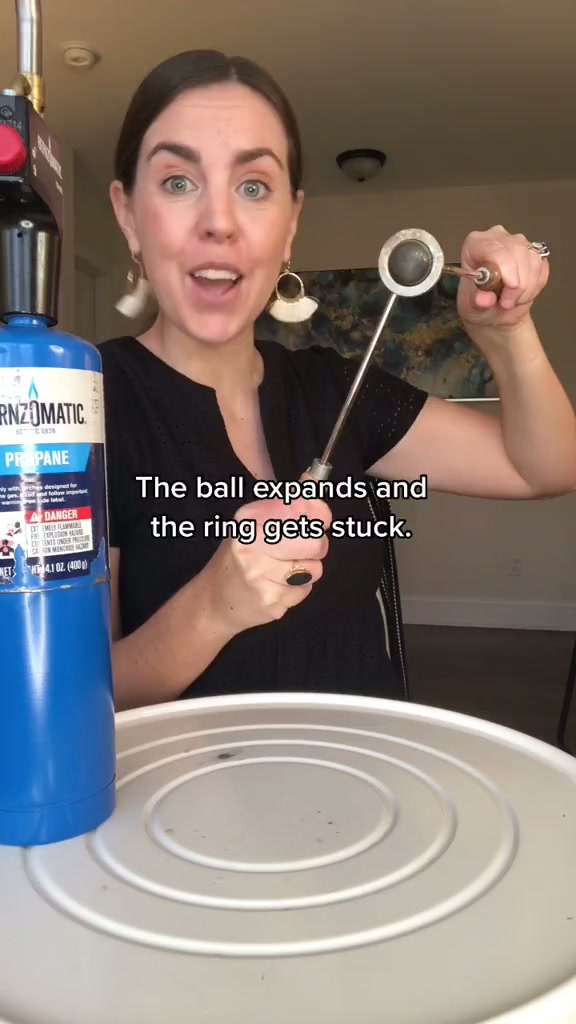 Why this heated metal ball suddenly will not fit the ring