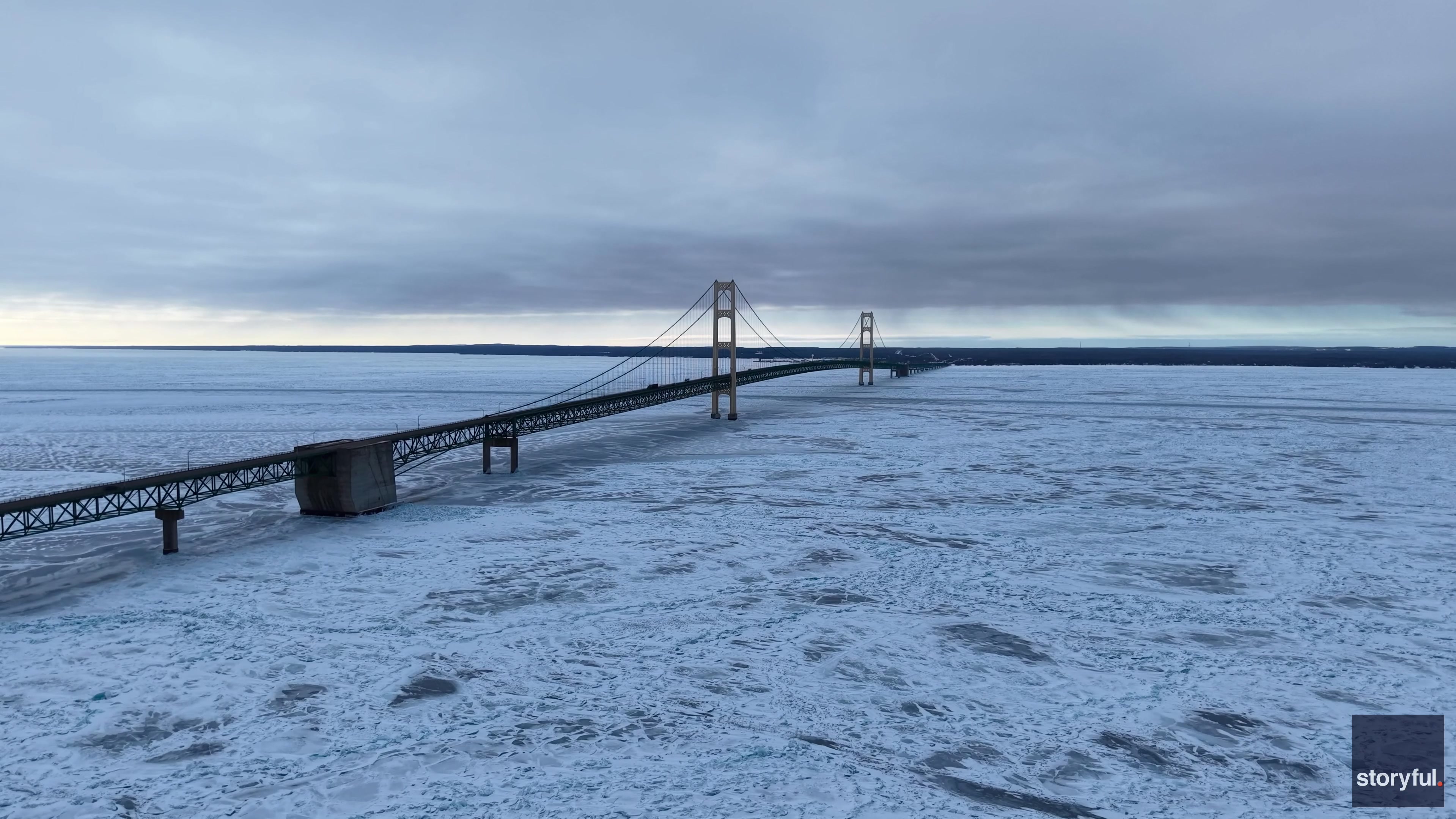 Aerial Footage Shows Michigan Bridge Tower Over Icy Lake