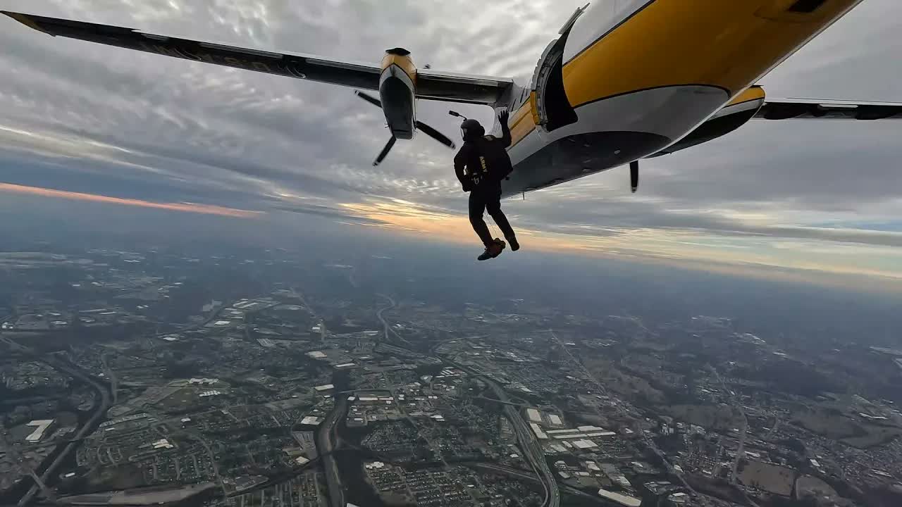Parachute team sergeant jumps from a plane