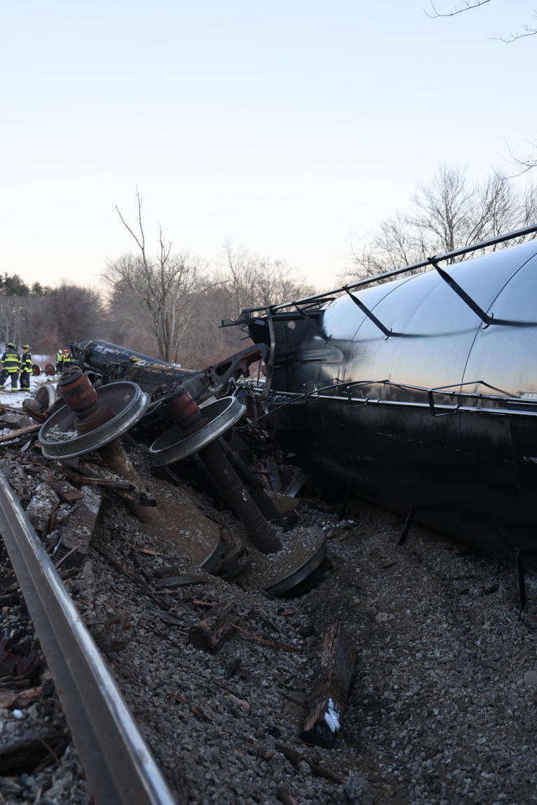 Rail cars removed from river and up righted after train derailment in ...