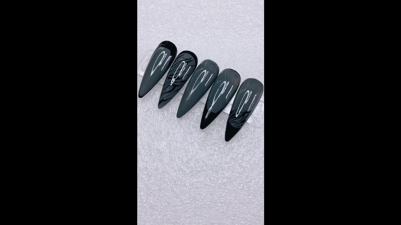 Satisfying smoky black glossy nail art with sleek marble effect
