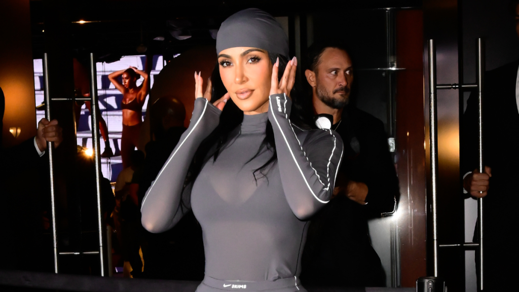 Kim Kardashian Layers a NikeSkims Towel Over High-Waisted Leggings