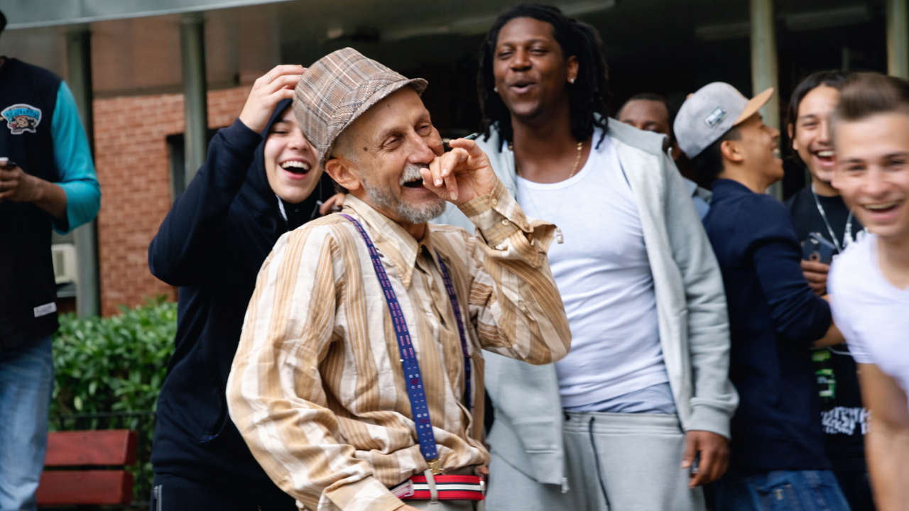 A grandpa surprises the crowd by rapping in public