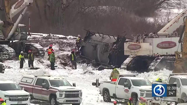 Rail cars removed from river and up righted after train derailment in ...