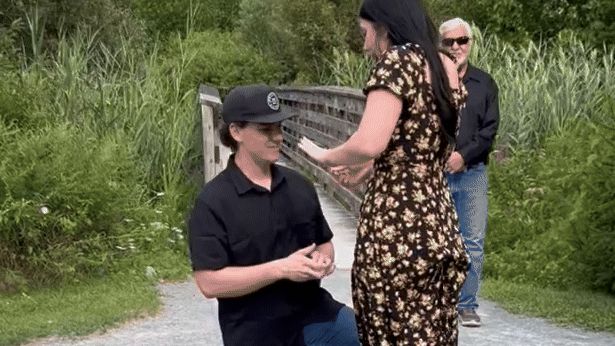 Nervous man throws up in bushes moments after successfully proposing to ...