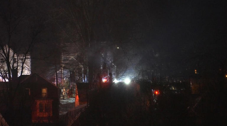 Fire trucks line the street battling structure fire in Warwood