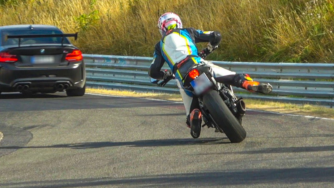 Insane drivers and fast bikers pushing limits at the Nurburgring track